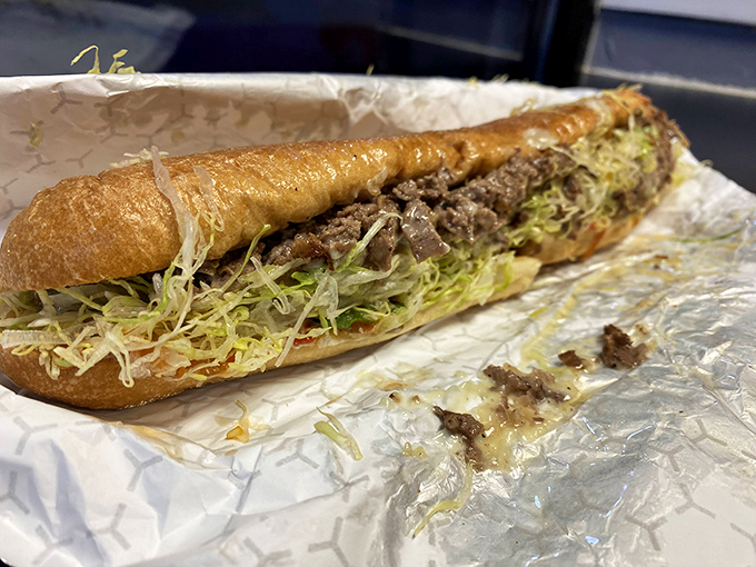 Behold the star of the show—a Philly cheesesteak in its natural habitat. That perfect ratio of meat to cheese to bread makes mathematicians weep with joy.
