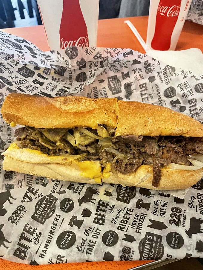 Behold the holy grail of Philadelphia cuisine &ndash; thinly sliced ribeye and molten cheese embraced by a perfect roll. Poetry in sandwich form.