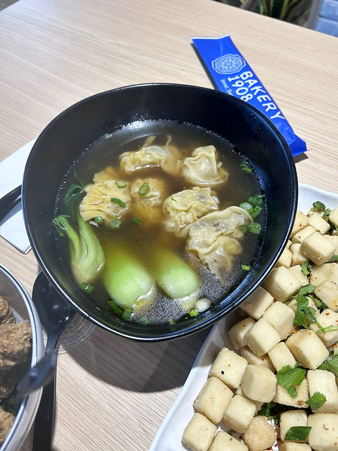 These wontons floating in clear broth are little flavor submarines, delivering perfect bites of pork with each delicate spoonful. The bok choy adds a fresh counterpoint.