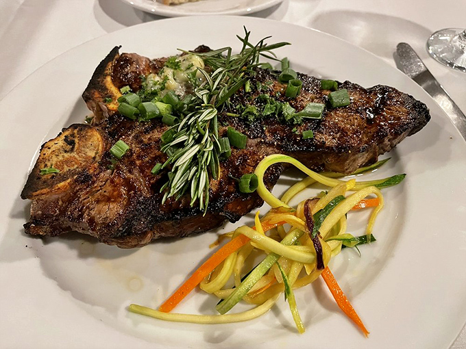 Behold the steak that launched a thousand food dreams. Perfectly charred exterior, rosemary garnish, and those julienned vegetables aren't just sides&mdash;they're supporting actors in a meaty masterpiece.