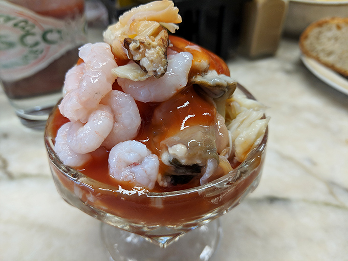 Seafood cocktail perfection &ndash; plump prawns and tender crab nestled in tangy sauce. The kind of dish that makes conversation stop and eyes close in appreciation.