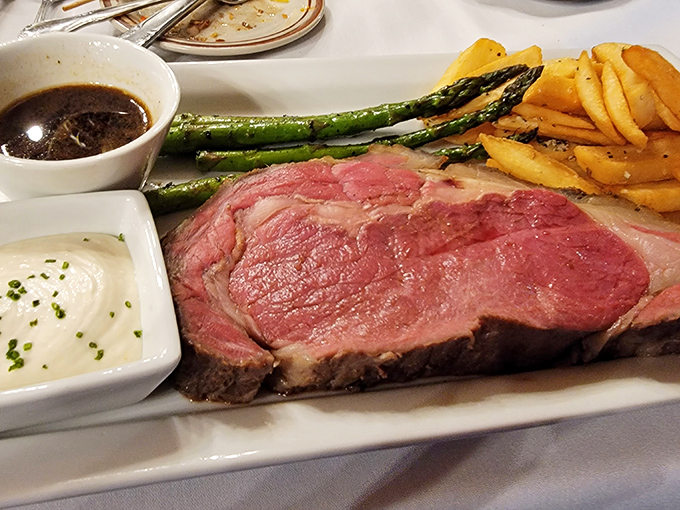 This prime rib doesn't just steal the show &ndash; it buys the theater. Perfectly pink, accompanied by asparagus and au jus for a classic steakhouse trifecta.