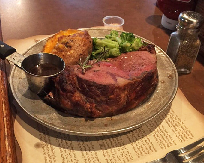 Behold the star attraction! This prime rib arrives like royalty&mdash;perfectly pink, accompanied by a golden baked potato and vibrant broccoli. The au jus is liquid gold.
