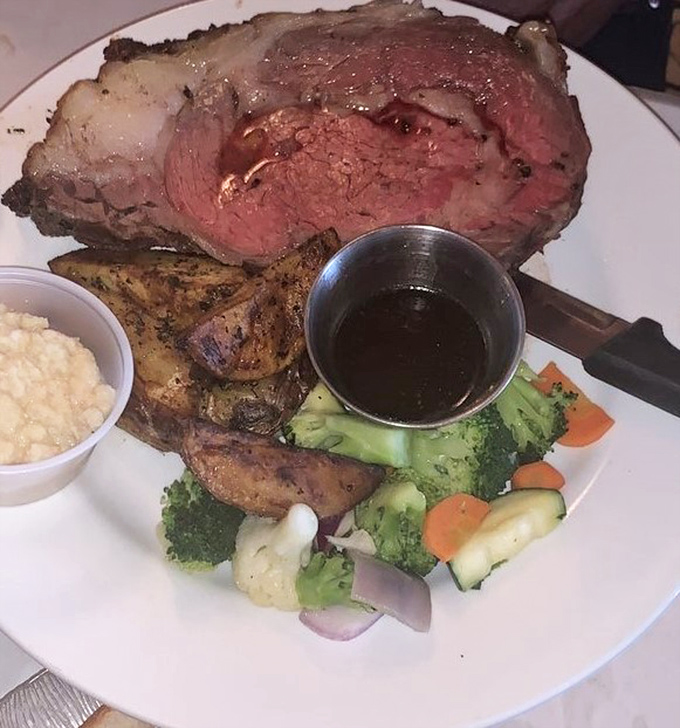 Behold the prime rib that launched a thousand road trips. That perfect pink center isn't just cooked—it's been carefully negotiated to delicious perfection.