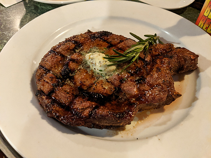 Behold the star of the show&mdash;a perfectly grilled steak topped with herb butter that's melting like your resolve to save room for dessert.