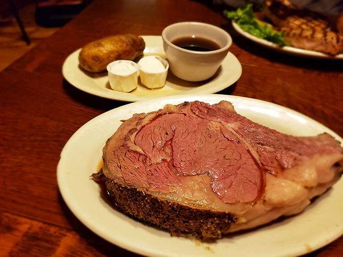 Prime rib so perfectly pink it could make a vegetarian question their life choices. That baked potato standing by like a faithful sidekick.