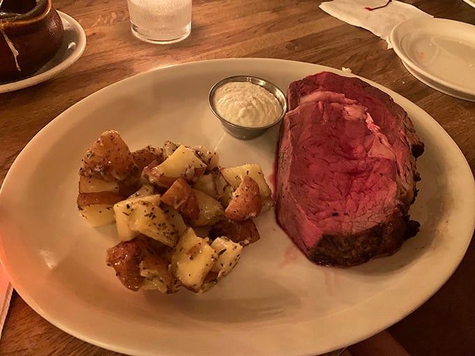 Behold the prime rib in its ruby-red glory, cooked to that magical point where tenderness meets flavor. Resistance is futile.
