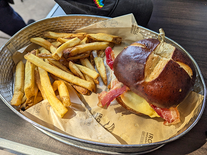 This isn't just a burger&mdash;it's architecture with flavor, where pretzel bun meets bacon in perfect harmony.