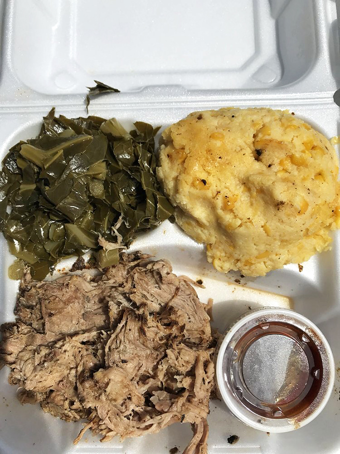 Tender pulled pork that practically melts on contact, paired with collards and mac & cheese—this is what BBQ dreams are made of.