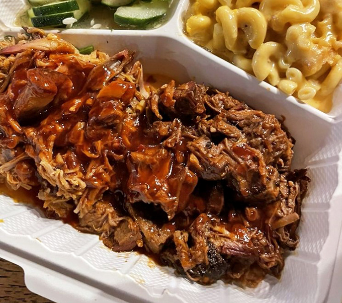 Pulled pork so tender it practically surrendered to the smoker, accompanied by mac and cheese that would make your grandmother both jealous and proud.