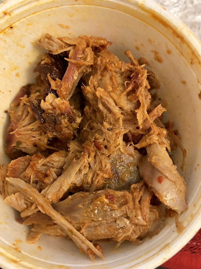 Pulled pork so tender it practically surrenders to your fork. This isn't just meat—it's a smokehouse symphony in a cup.