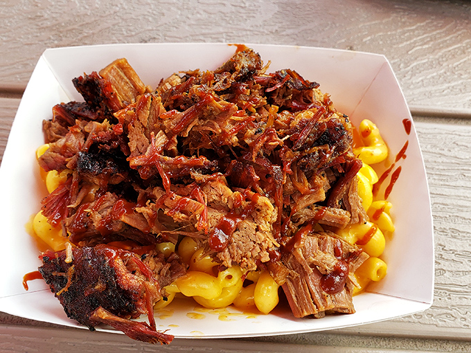 Pulled pork atop mac and cheese&mdash;a relationship more perfect than any Hollywood romance. The sauce adds that dramatic third-act twist.
