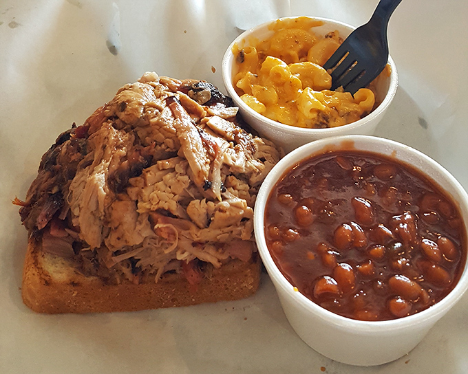 Pulled pork perfection on Texas toast with mac and beans. This isn't just lunch&mdash;it's what happiness would look like if it took physical form.