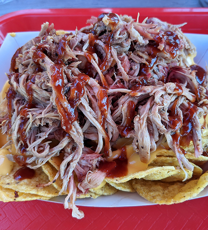 Pulled pork so tender it practically surrenders at the sight of your fork, glistening with that perfect balance of smoke and sauce.