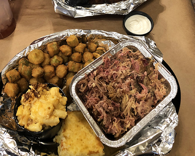 A BBQ masterpiece deconstructed: pulled pork alongside golden mac and cheese, cornbread, and what might be the world's most perfect okra.