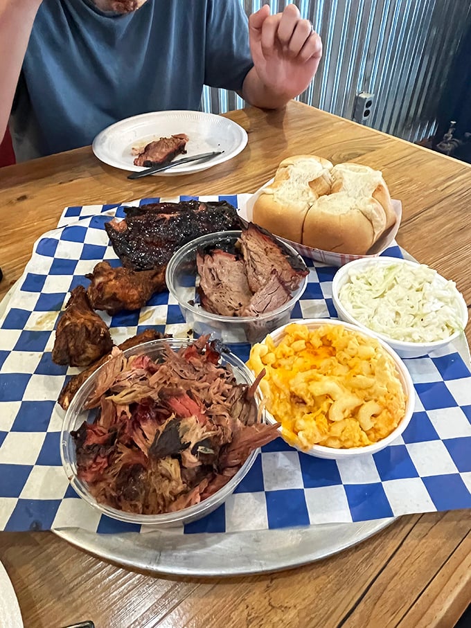 Barbecue heaven on a blue-checkered altar. This sampler platter doesn't just speak to you&mdash;it sings a full-throated carnivore's anthem.