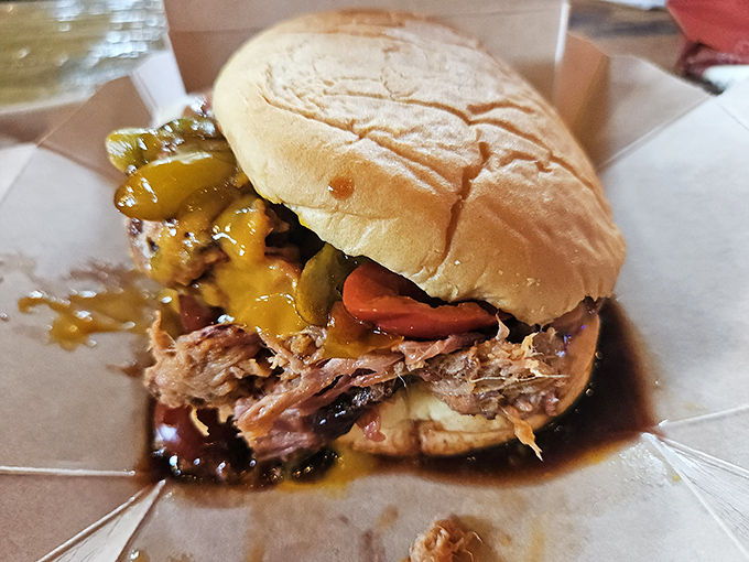 This isn't just a sandwich; it's a masterpiece of slow-smoked pork, tangy sauce, and pickles that might just make you weep with joy.