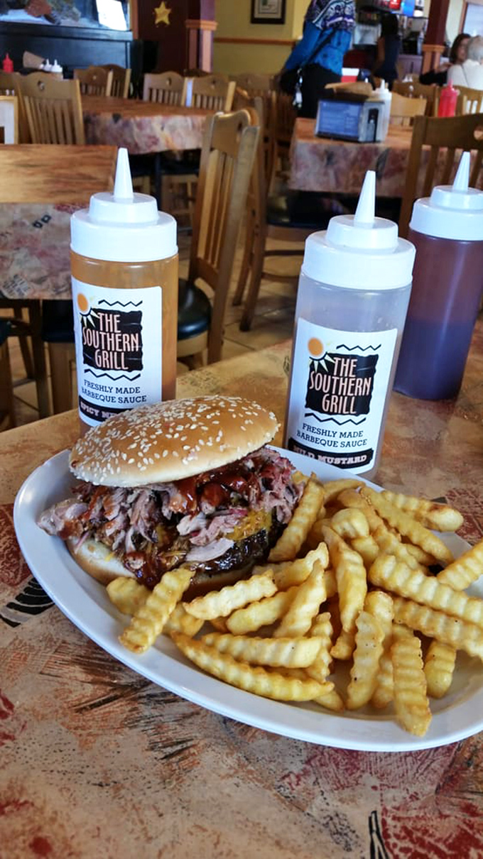 The star of the show: a pulled pork sandwich that's worth crossing county lines for, accompanied by crispy crinkle-cut fries and house-made sauce bottles standing guard.