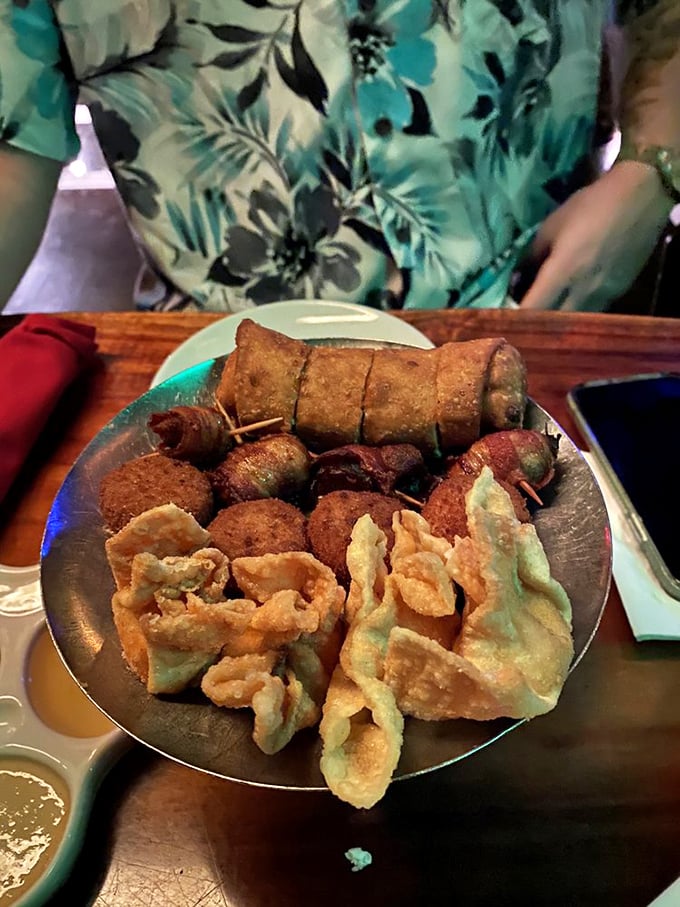 The Pupu Platter arrives like a greatest hits album of fried deliciousness. Egg rolls, crab rangoon, and other crispy companions that demand to be shared.