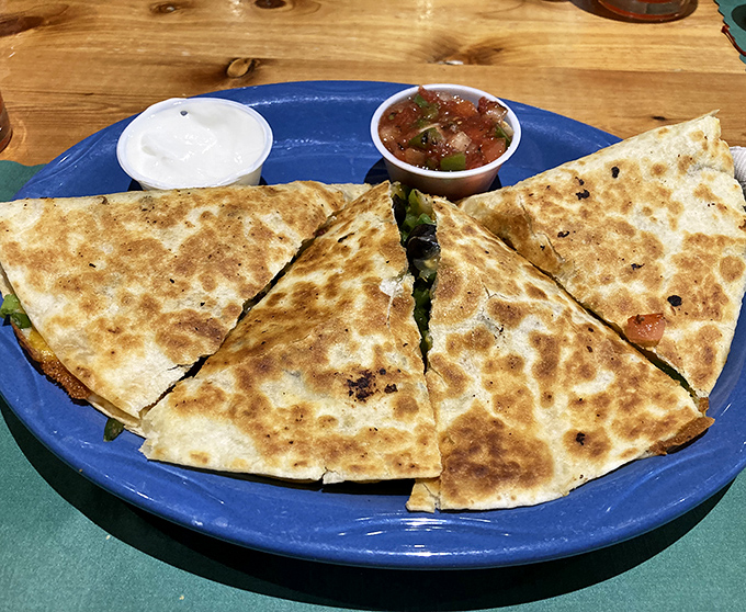 Golden-brown tortilla triangles hiding smoky treasures within&mdash;this quesadilla isn't just a meal, it's the reason GPS was invented.