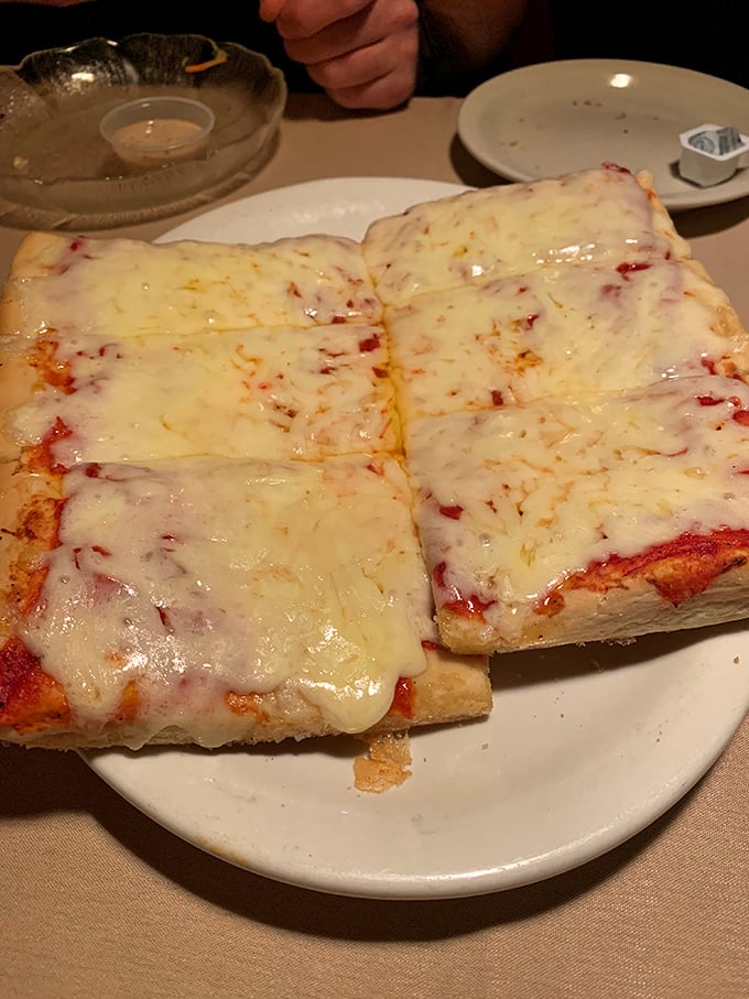 Behold the red pizza in all its glory&mdash;those perfect squares of melty cheese and slightly sweet sauce atop that legendary crust.