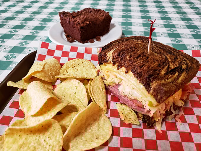 The star of the show in all its glory&mdash;a perfectly grilled Reuben with chips and a brownie chaser. This isn't just lunch; it's a religious experience.