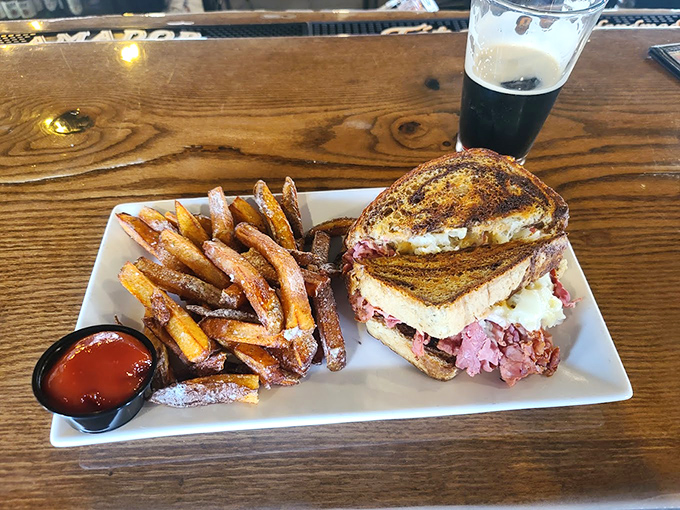 The star of the show in all its glory &ndash; a Reuben that doesn't need height to impress, just perfectly balanced corned beef, sauerkraut, and Swiss on grilled rye.