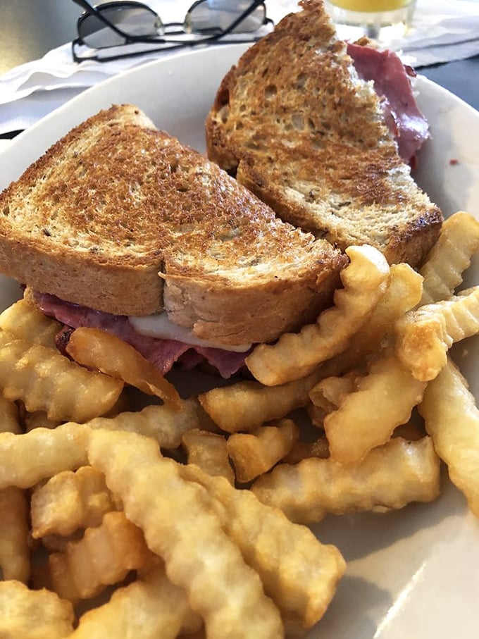 A proper Reuben doesn't need fancy presentation&mdash;just perfectly grilled rye, generous corned beef, and those gloriously golden crinkle-cut fries.