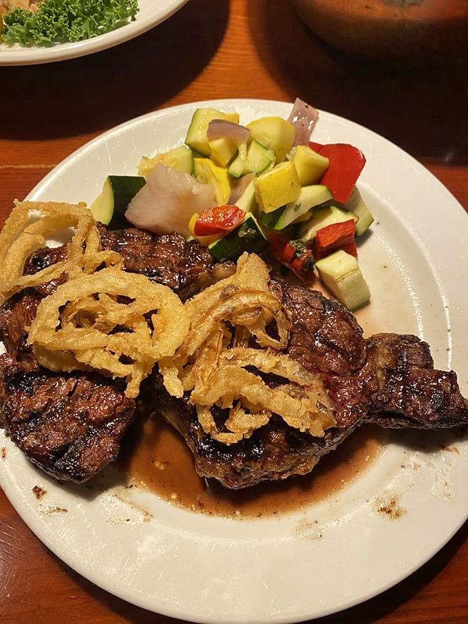 This isn't just a steak&mdash;it's a declaration of love to beef. Those crispy onion rings and fresh vegetables provide moral support to the star of the show.