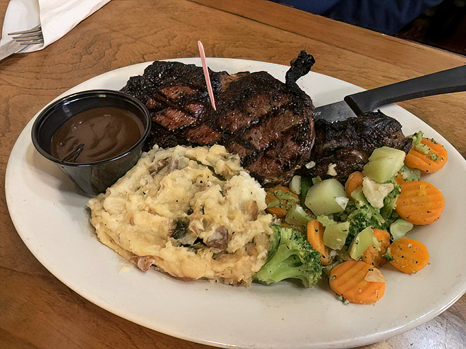 Behold the star of the show! This perfectly charred rib eye comes with creamy mashed potatoes and vegetables that aren't just plate decorations.