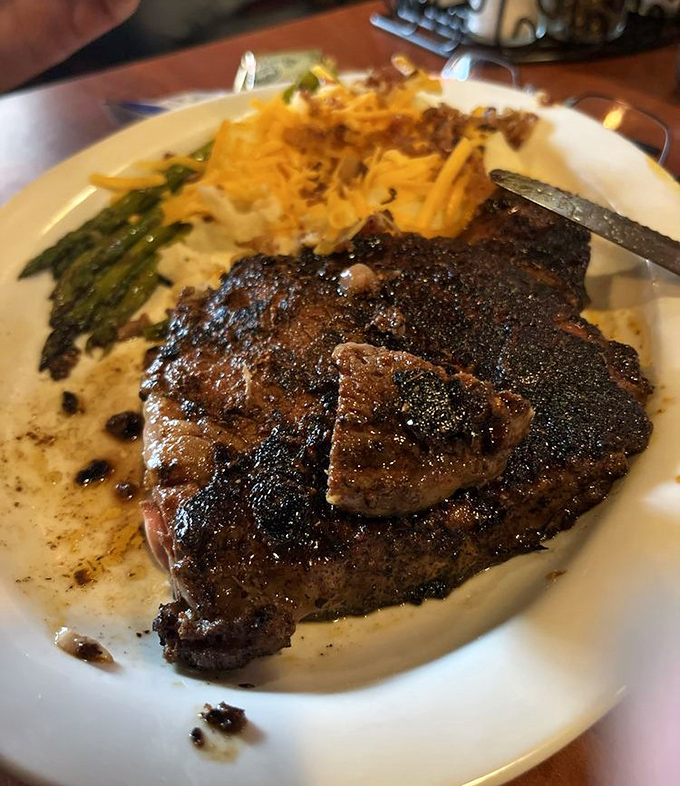 Meat candy for grown-ups. This perfectly seared ribeye with its caramelized crust and sides of asparagus and loaded potato is Georgia's answer to fine dining.