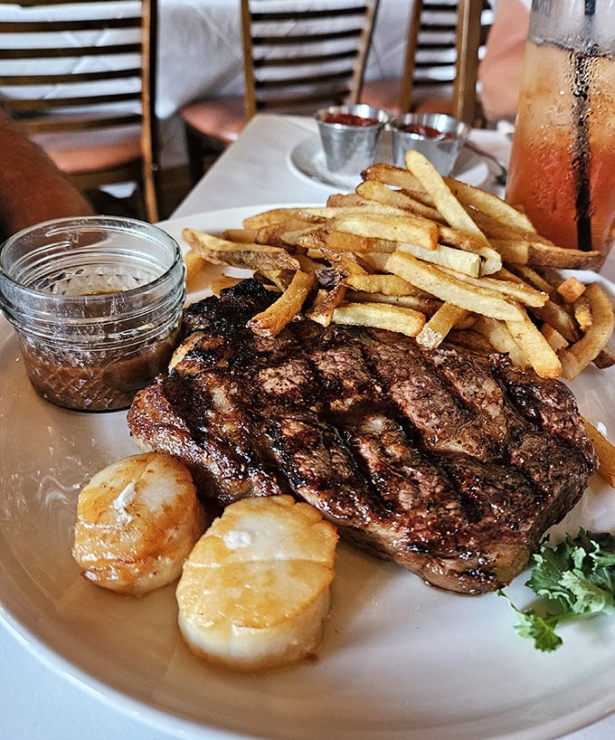 A perfectly seared steak with golden fries and plump scallops&mdash;this plate doesn't need Instagram filters, just your undivided attention.
