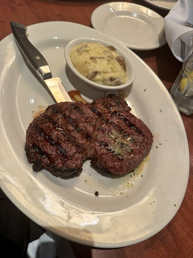This isn't just a steak; it's a masterpiece of meat chemistry&mdash;perfectly seared filet medallions with a side of decadence in creamy potato form.