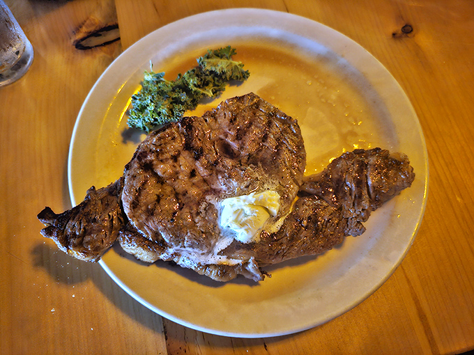 A perfectly cooked ribeye with a pat of melting butter on top&mdash;proof that sometimes the simplest pleasures are the most profound.