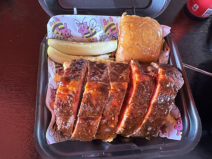 These aren't just ribs; they're edible evidence that patience is a virtue. That glistening bark and perfect knife work? Pure Texas poetry.