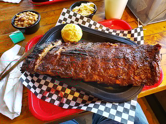 Not all heroes wear capes&mdash;some come on a checkered paper with cornbread and sides. These ribs don't just fall off the bone, they practically leap.