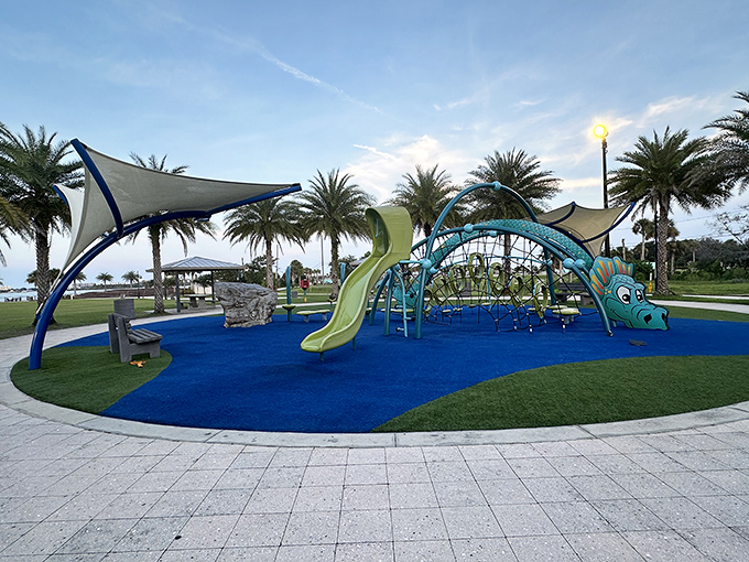 Blue slides and whimsical sea creature designs make this playground a kiddie paradise where "five more minutes" always stretches to thirty.