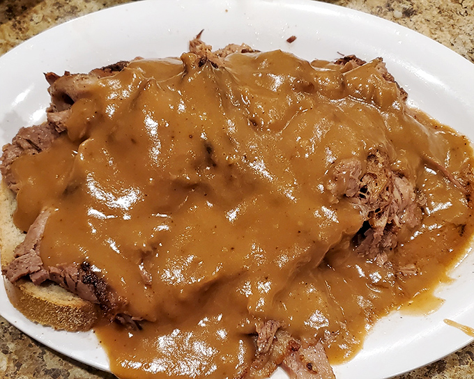 This isn't just roast beef – it's a gravy-soaked masterpiece that makes you understand why people willingly cross county lines for a sandwich.