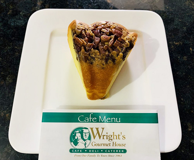 This rum cake isn't just dessert, it's an event. The glistening pecans perched atop that golden dome are sentinels guarding a treasure of buttery, boozy perfection.