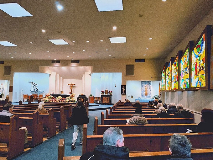 This church's stained glass windows tell stories in technicolor, bathing worshippers in light that's been filtering through faith for generations.
