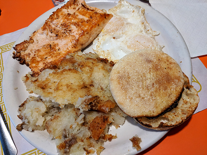 This plate doesn't just serve breakfast, it performs a symphony of textures &ndash; crispy salmon, fluffy eggs, and that English muffin toasted to golden perfection.