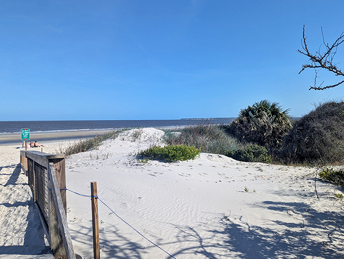 Gateway to paradise. The dunes serve as nature's velvet rope, protecting the delicate ecosystem while welcoming respectful visitors.