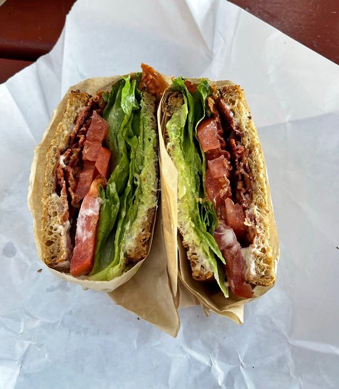 This isn't just a sandwich; it's edible architecture – layers of fresh ingredients in perfect harmony, like the Beatles if they were lunch.