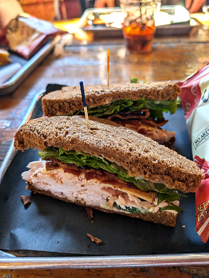 Classic turkey sandwich? Hardly. This multi-layered masterpiece proves simple ingredients become extraordinary in the right hands.