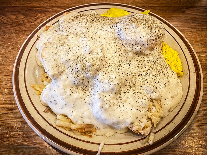 Behold the crown jewel of Ohio breakfast architecture&mdash;sausage gravy cascading over potatoes like a peppery waterfall. Cardiologists hate this one simple trick.