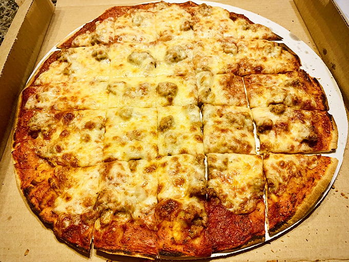 Square-cut tavern-style pizza that shatters with each bite. This sausage masterpiece is what Chicagoans actually eat when cameras aren't looking.