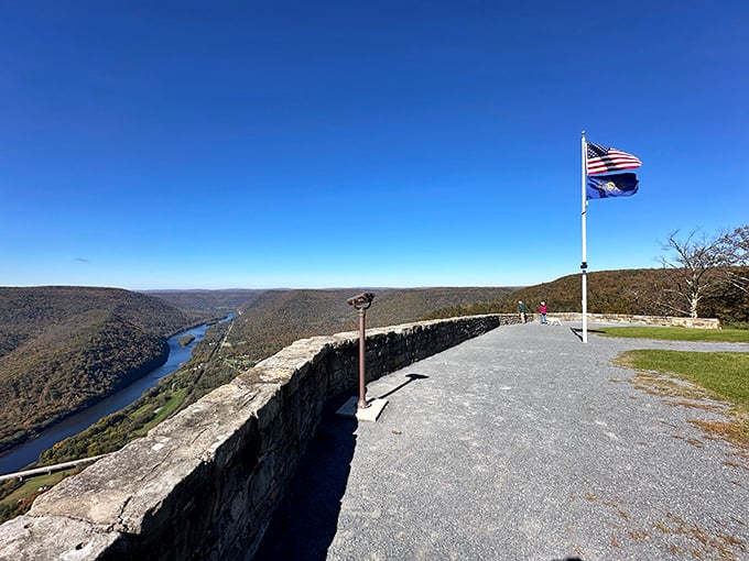 The stone wall between you and a 1,949-foot plummet offers both safety and the perfect frame for nature's masterpiece below.