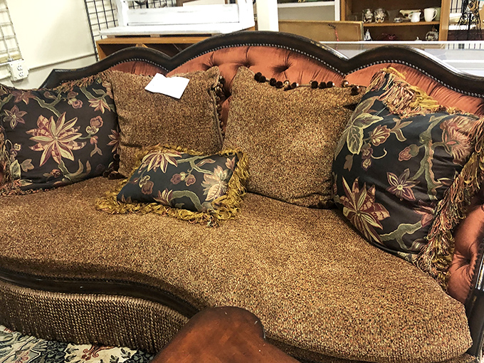 Opulence from another era awaits a new home. This sofa has hosted more fascinating conversations than most talk shows.