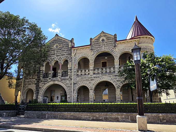 The Schreiner Mansion's distinctive turret and limestone arches transport you to another era. It's like a European castle decided to vacation in Texas.