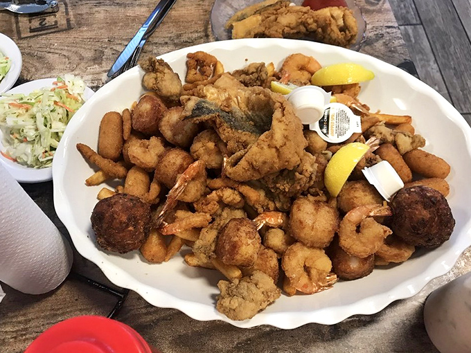 Seafood nirvana on a plate. This fried sampler isn't trying to win beauty contests &ndash; it's too busy making your taste buds dance.